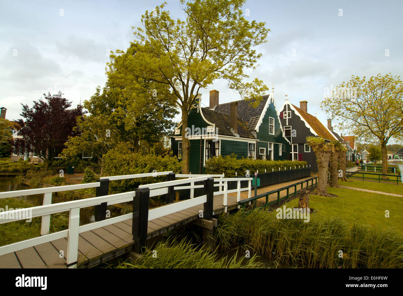 rural dutch scenery of small old houses and canal in Zaanse ...