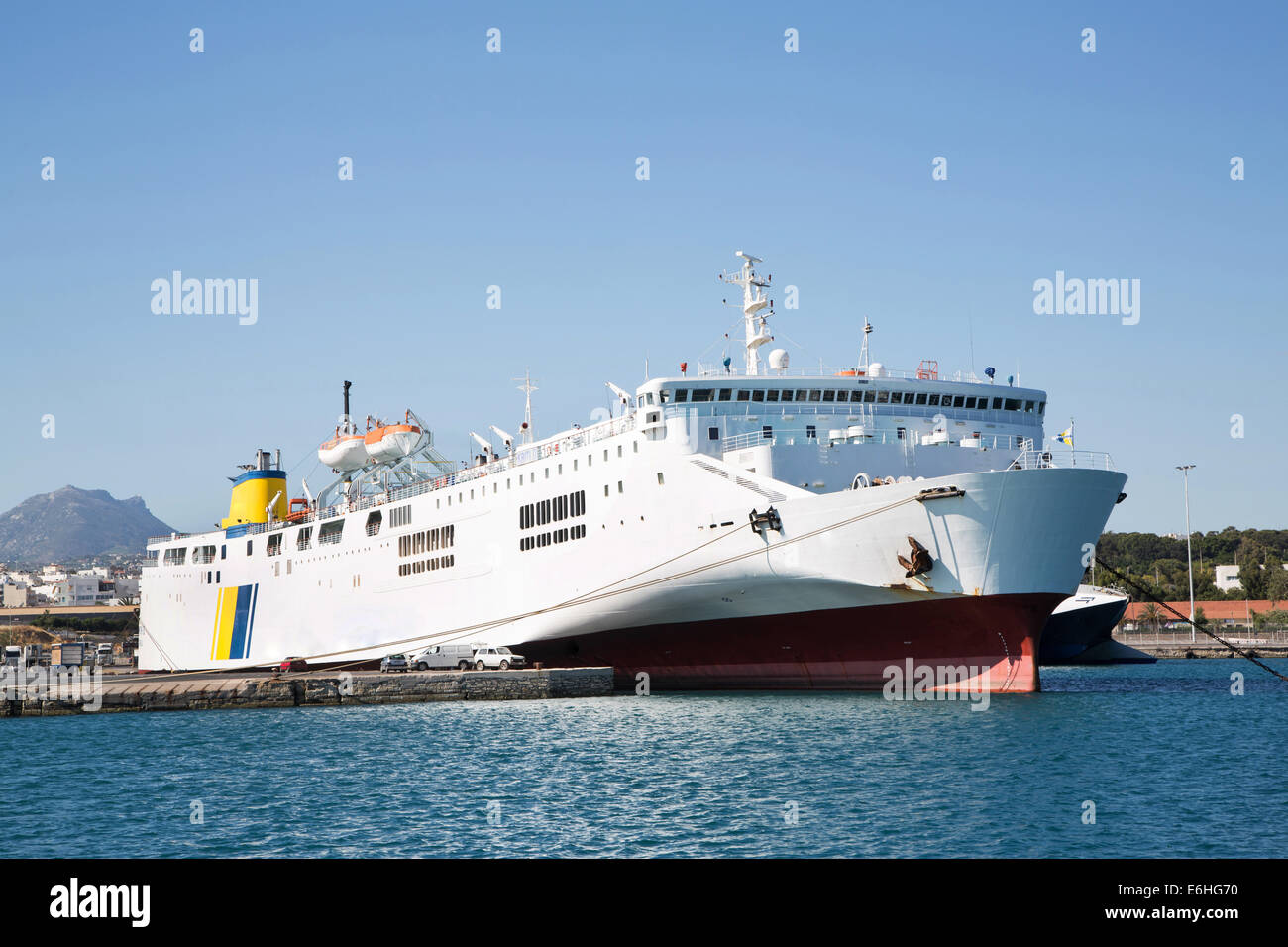 Big and large ferry boat or cargo ship in the port with blue sky Stock ...