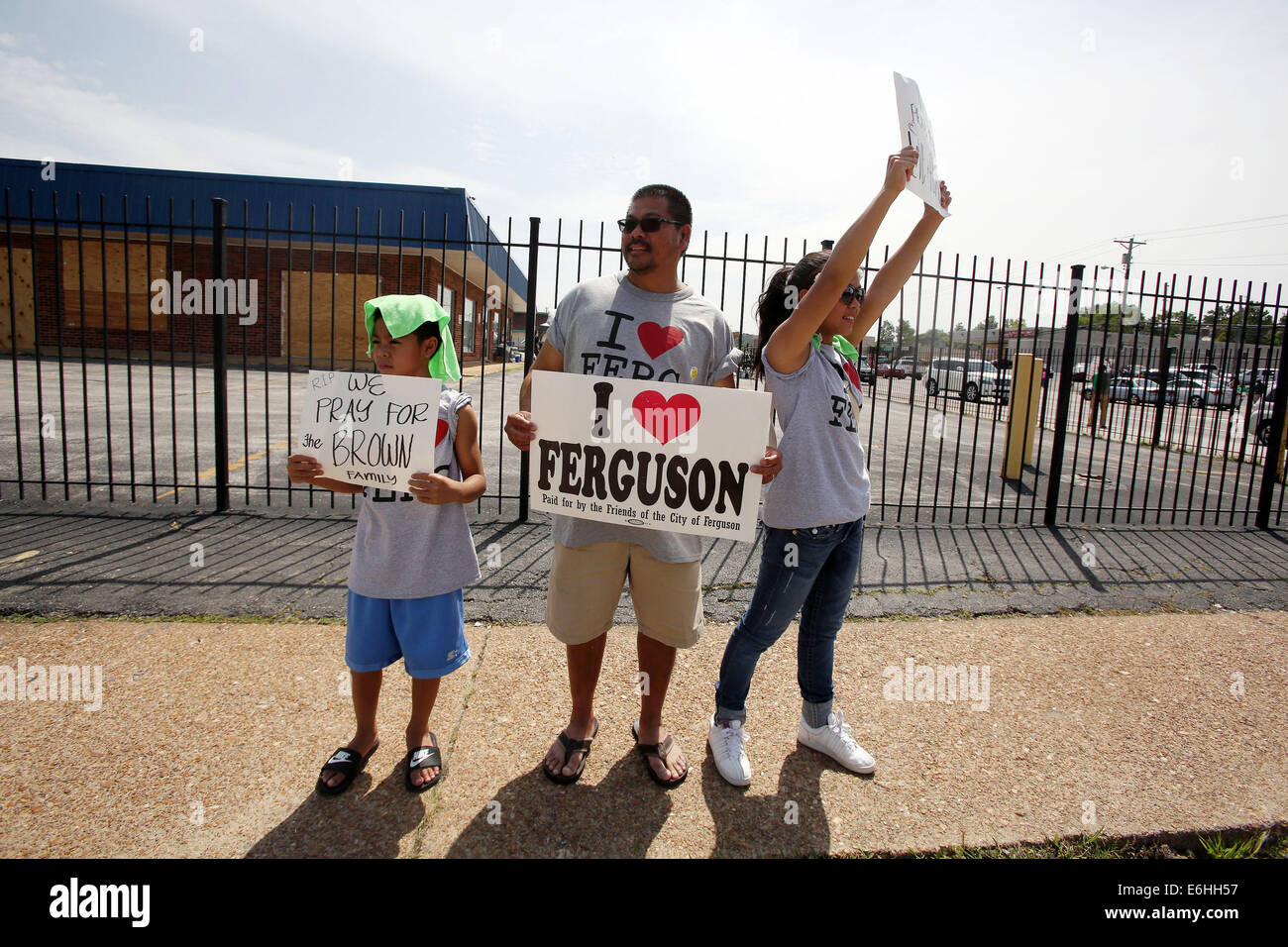 Ferguson, MO, USA. 23rd Aug, 2014. People hold signs in Ferguson. After ...