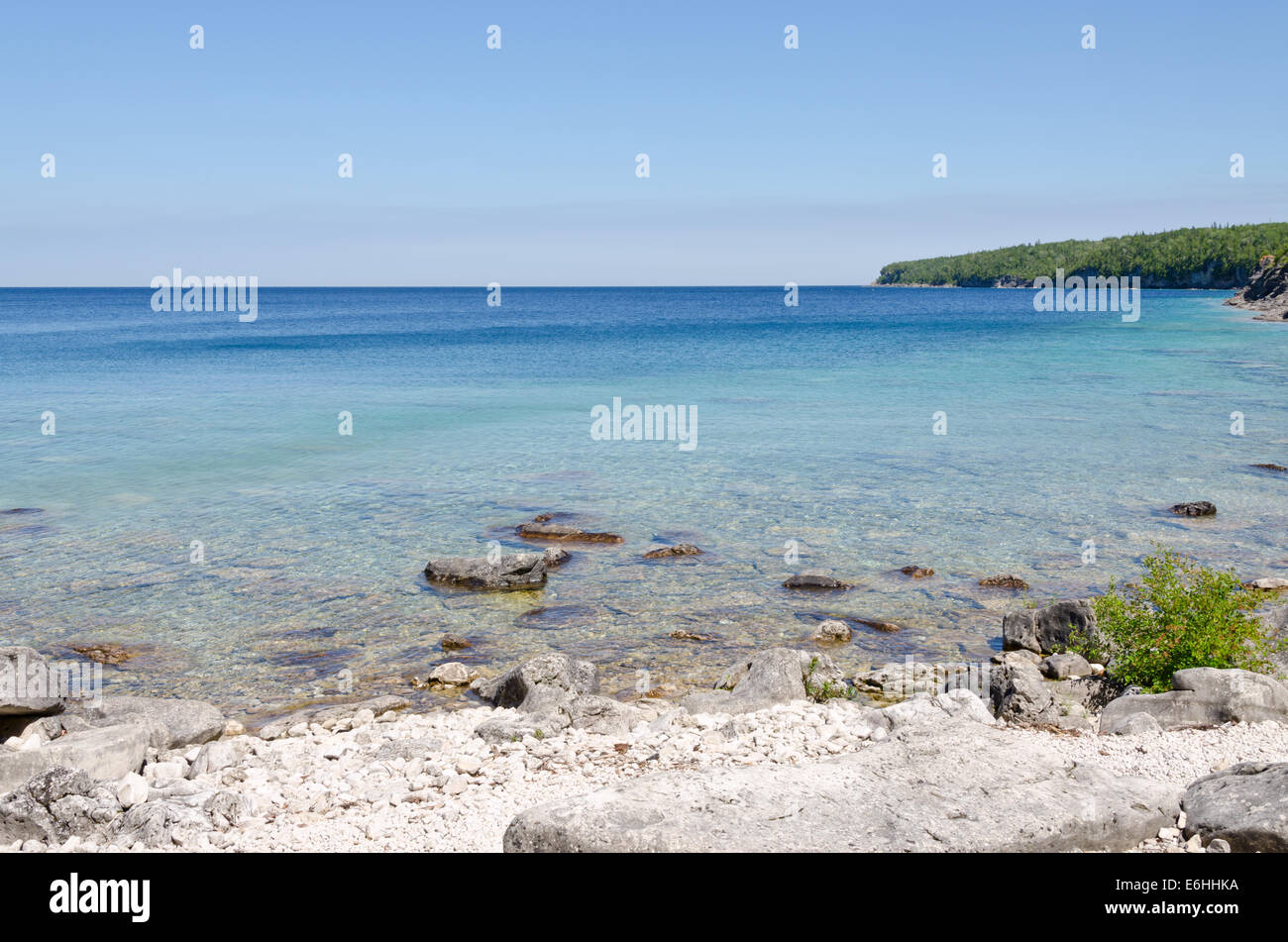 Green and blue water of Huron Lake, Ontario under blue sky Stock Photo ...