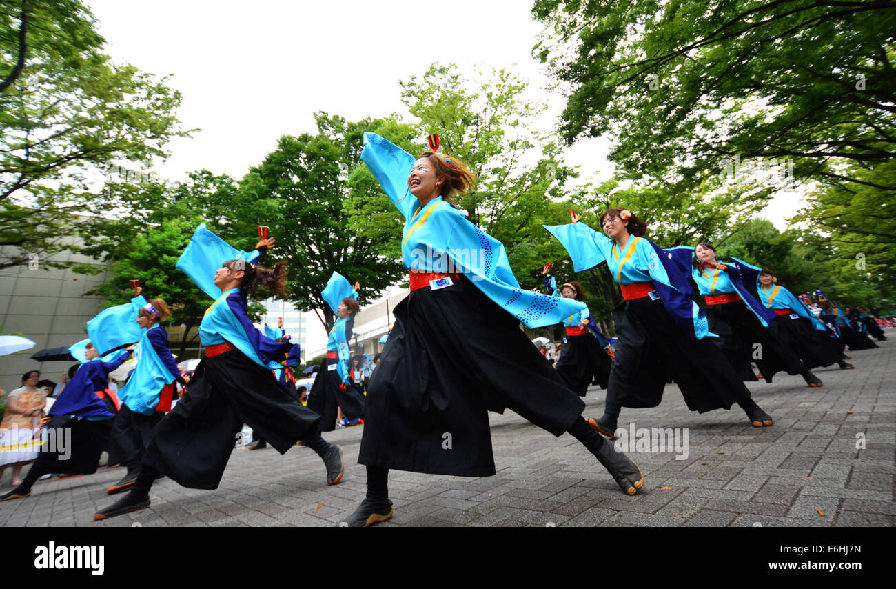 Tokyo, Japan. 23rd Aug, 2014. Participants in colorful costumes dance ...