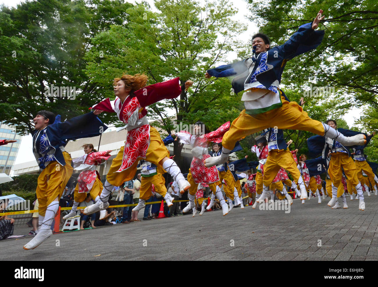 Tokyo, Japan. 23rd Aug, 2014. Participants in colorful costumes dance ...