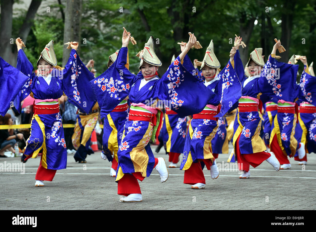Tokyo, Japan. 23rd Aug, 2014. Participants in colorful costumes dance ...
