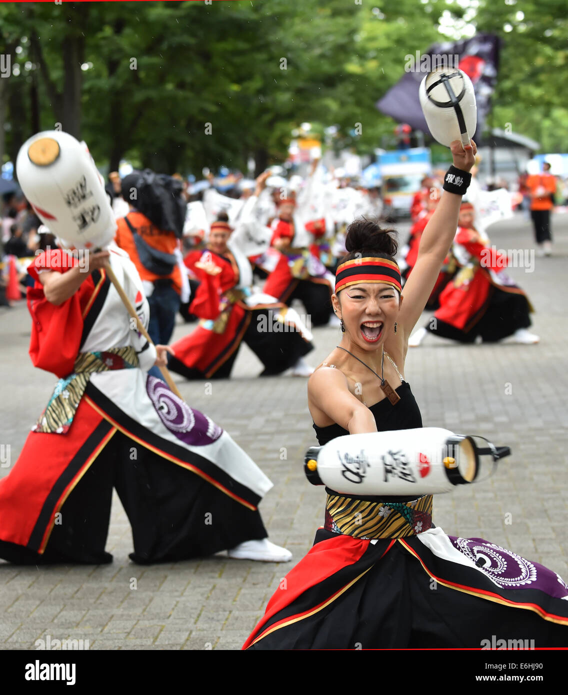 Tokyo, Japan. 23rd Aug, 2014. Participants in colorful costumes dance ...
