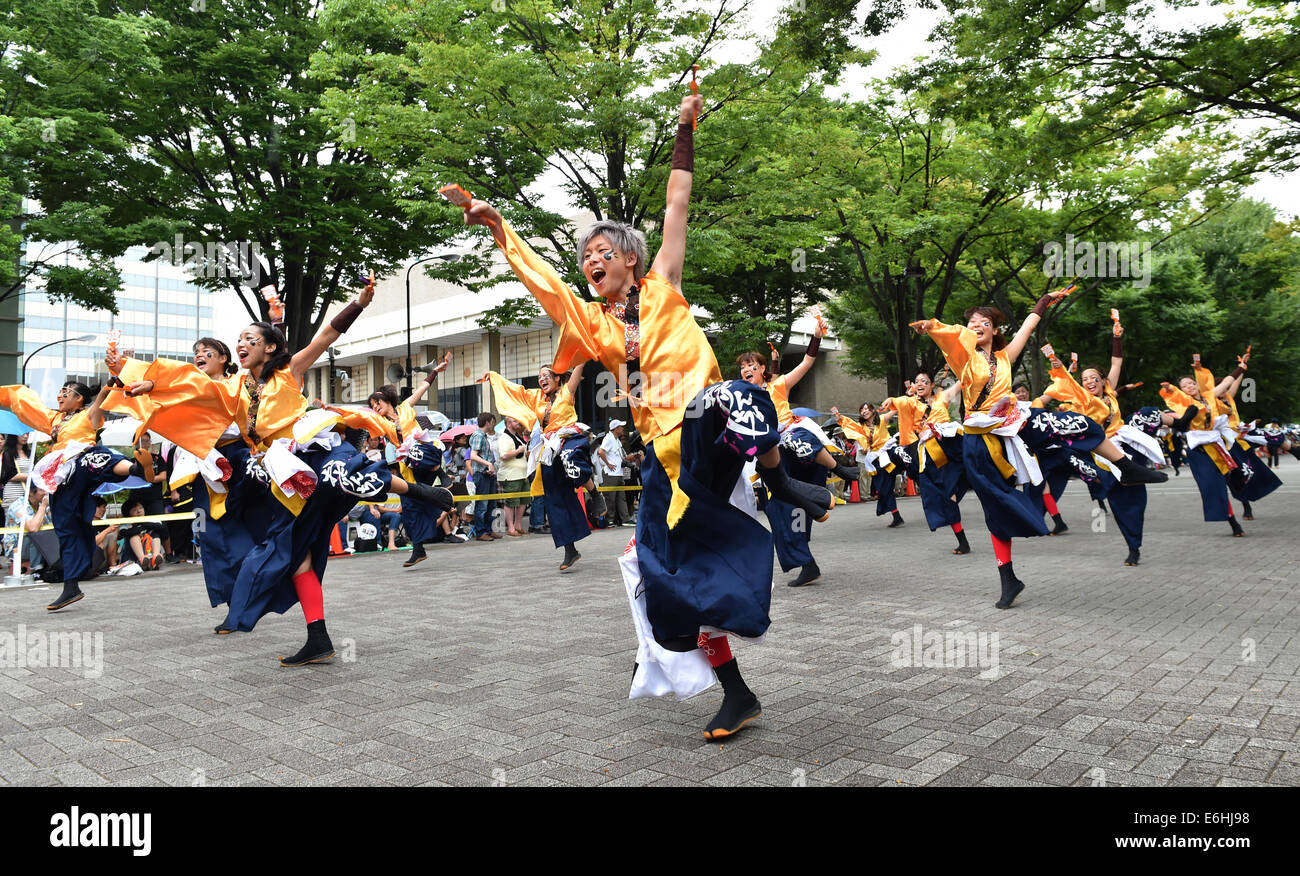 Tokyo, Japan. 23rd Aug, 2014. Participants in colorful costumes dance ...