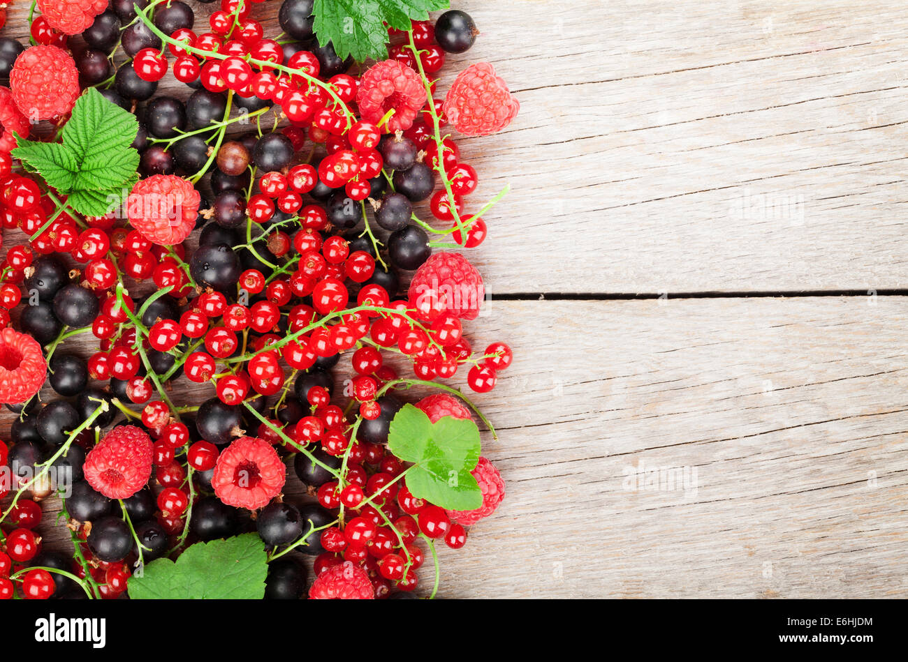 Fresh ripe berries on wooden table background with copy space Stock ...