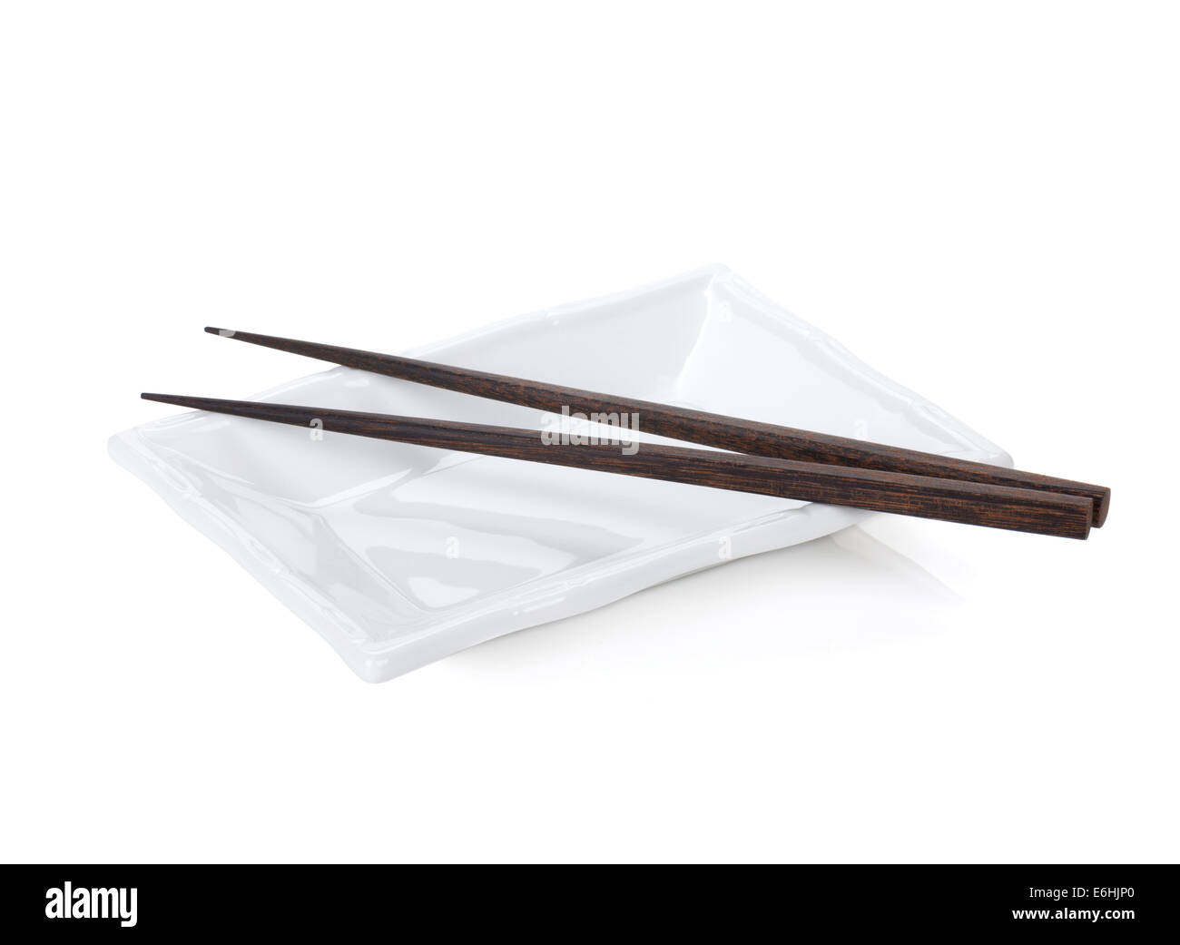 Chopsticks and plate. Isolated on white background Stock Photo - Alamy