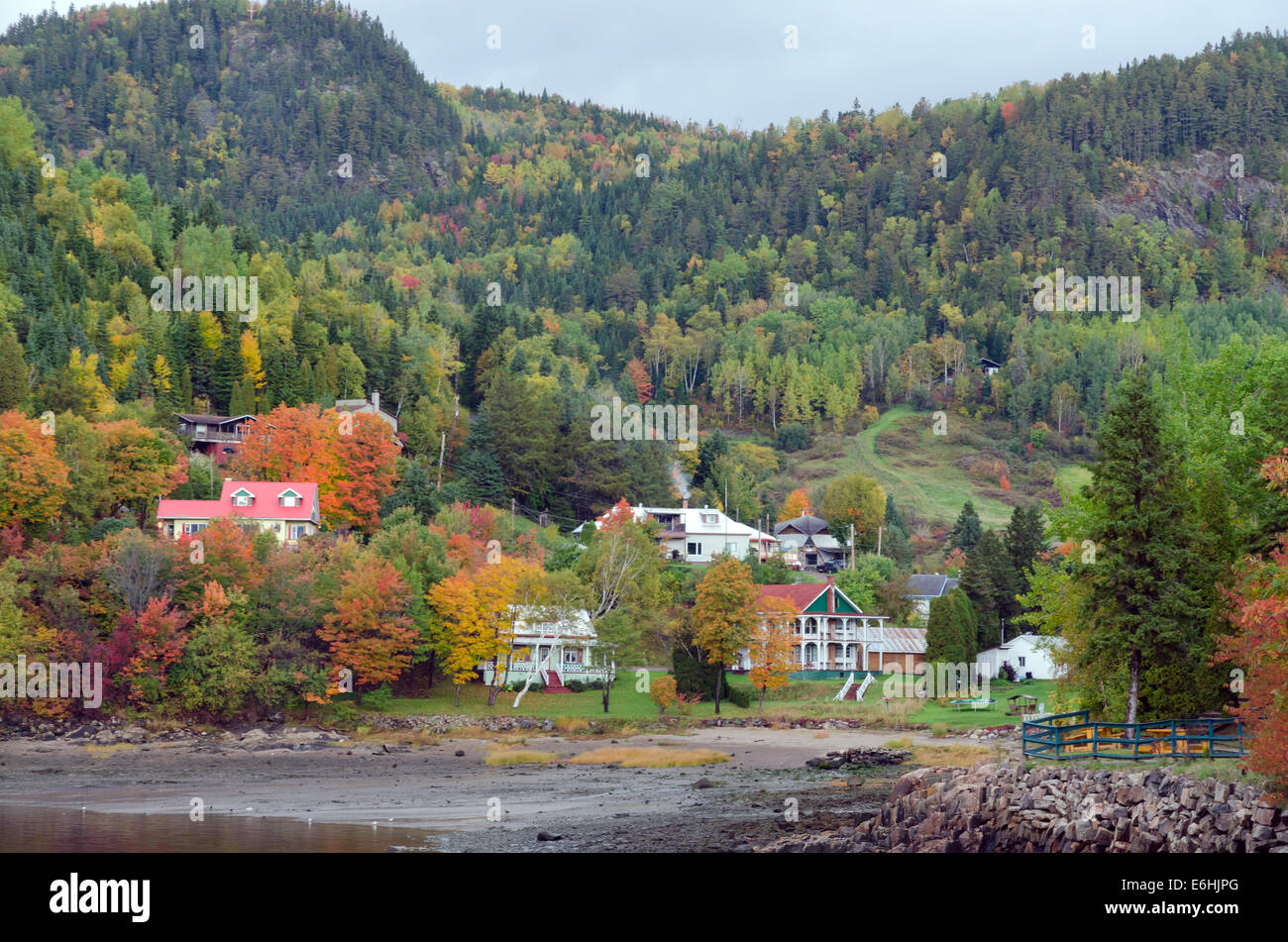 Beautiful homes on hillside surrounded by colorful autumn foliage Stock ...