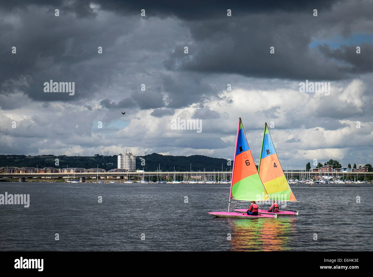 Bad weather approaches as colourful dinghies sail on Cardiff bay Stock ...