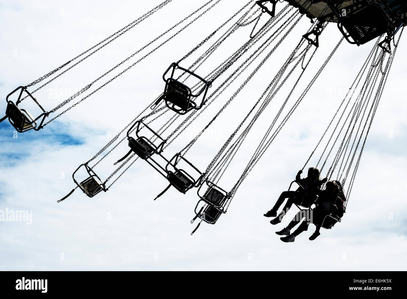 The silhouette of children on a fairground ride Stock Photo - Alamy