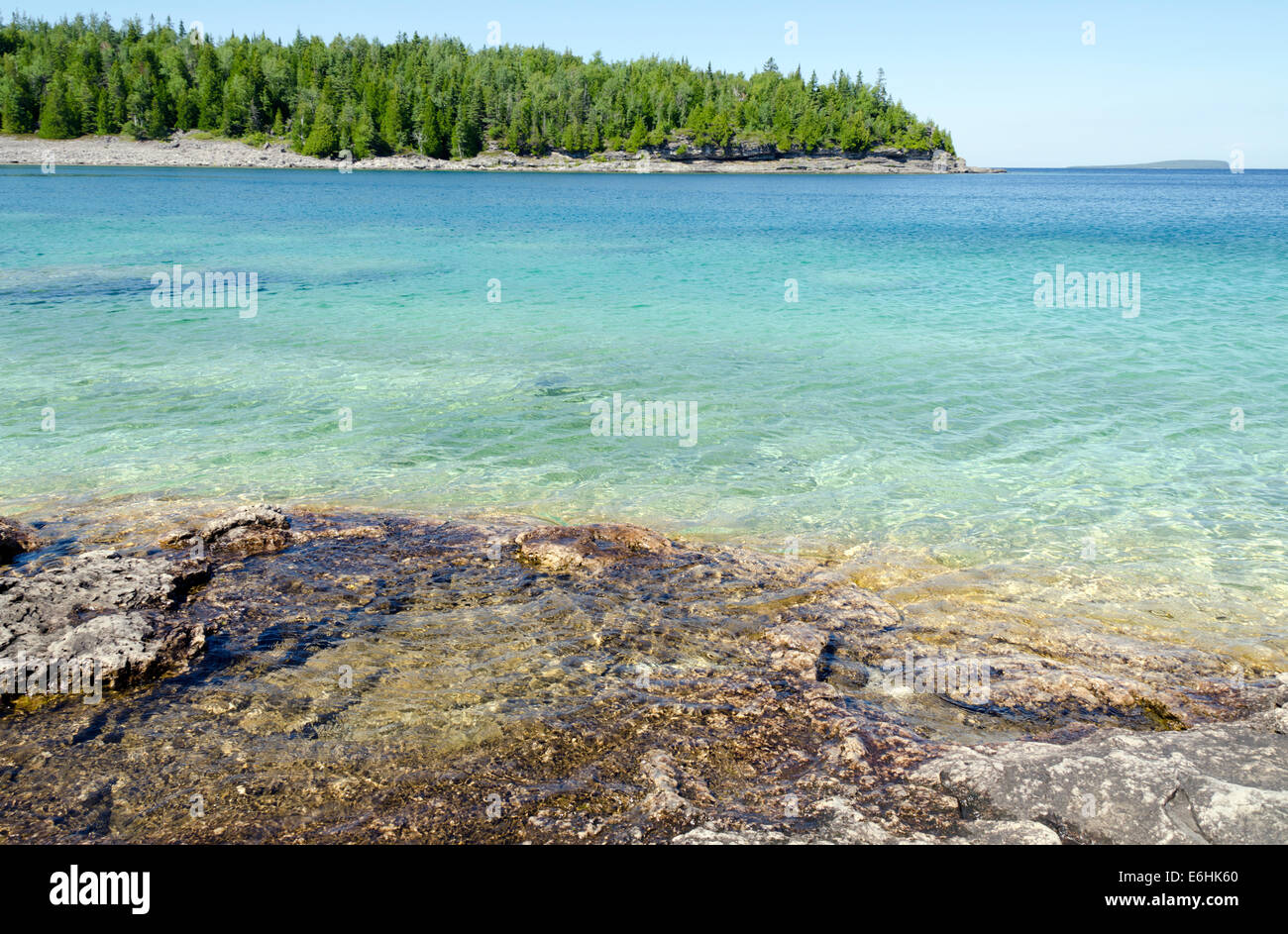 Green and blue water of Huron Lake, Ontario under blue sky Stock Photo ...