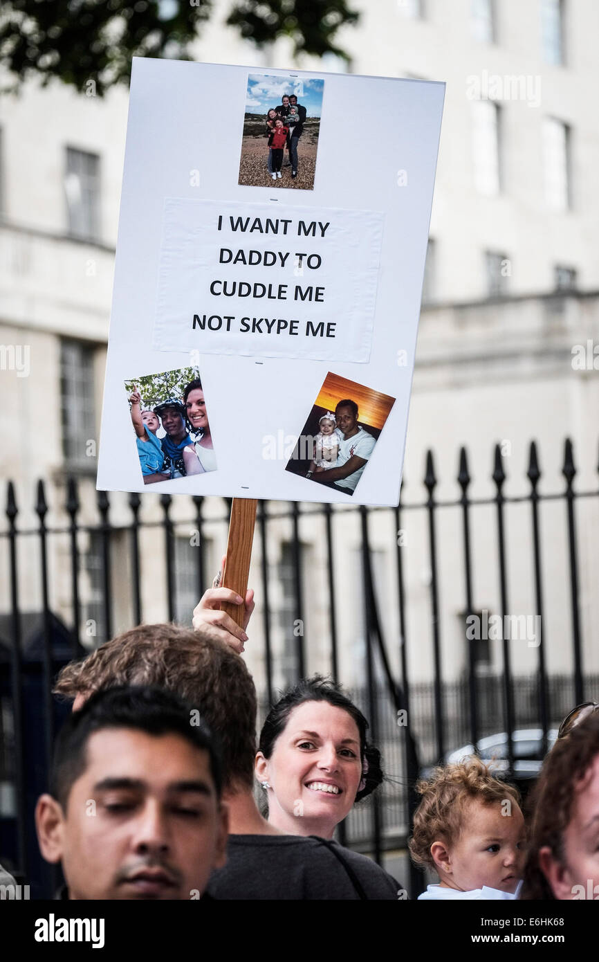 Sarah Angelina holds up a placard at a demonstration protesting against ...