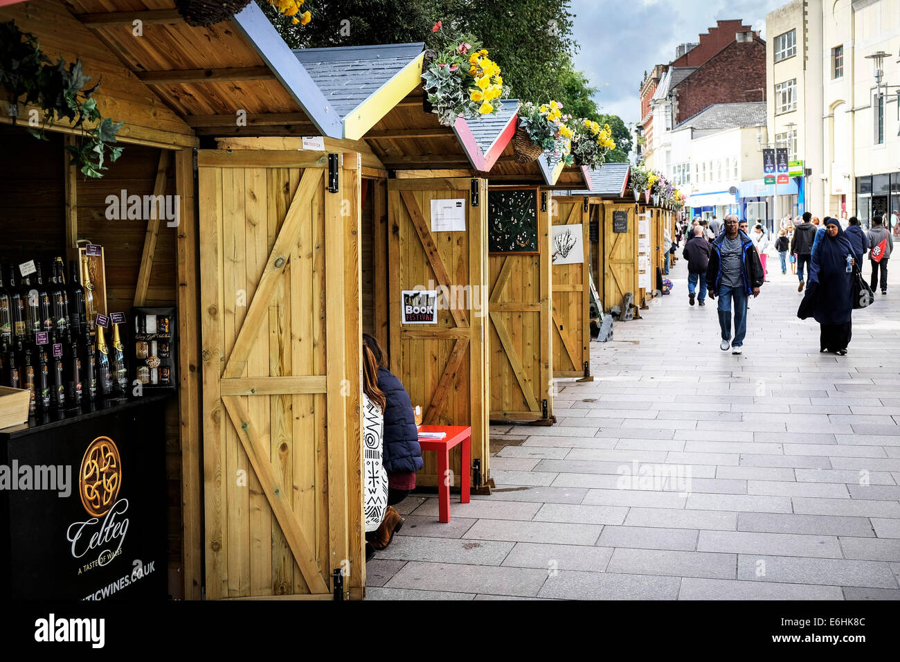 Wooden huts used as retail units in Cardiff City centre Stock Photo - Alamy
