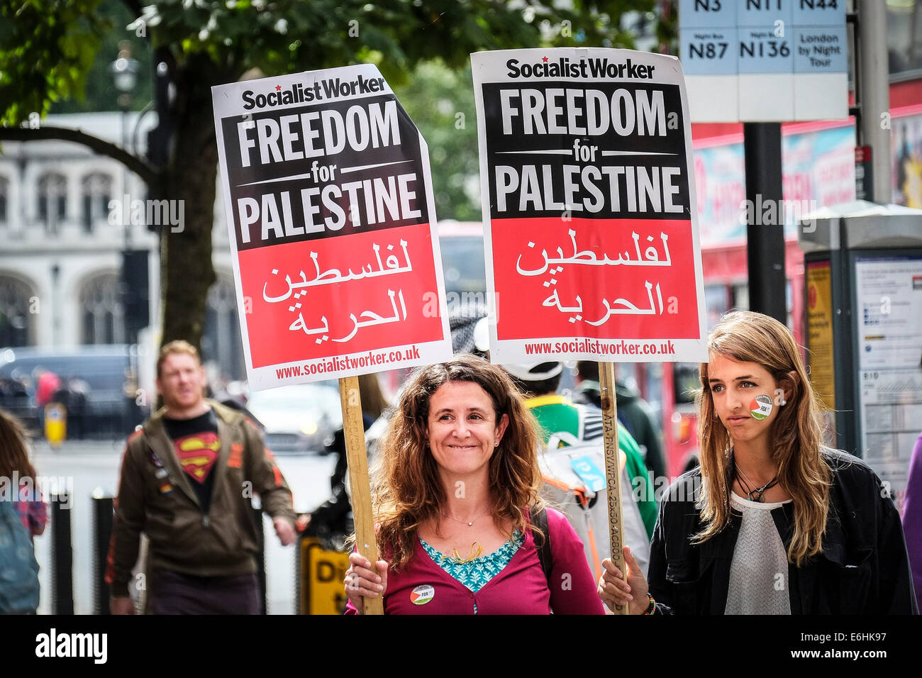 Pro-Palestinian protesters demonstrate outside Downing street against ...