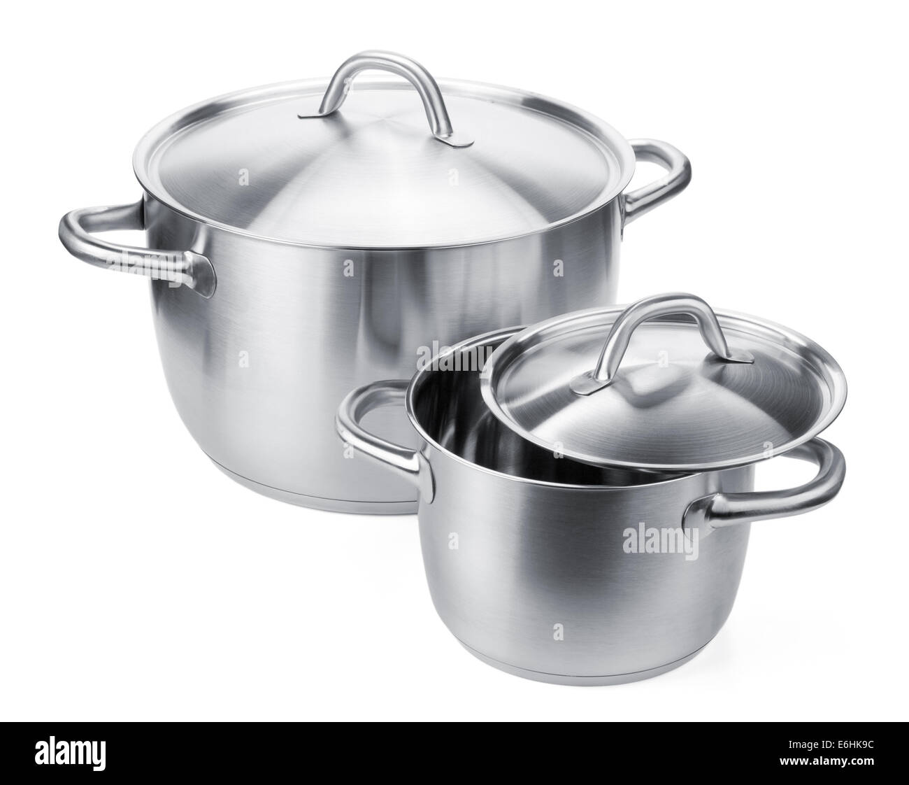 Two stainless steel pots. Isolated on white background Stock Photo - Alamy