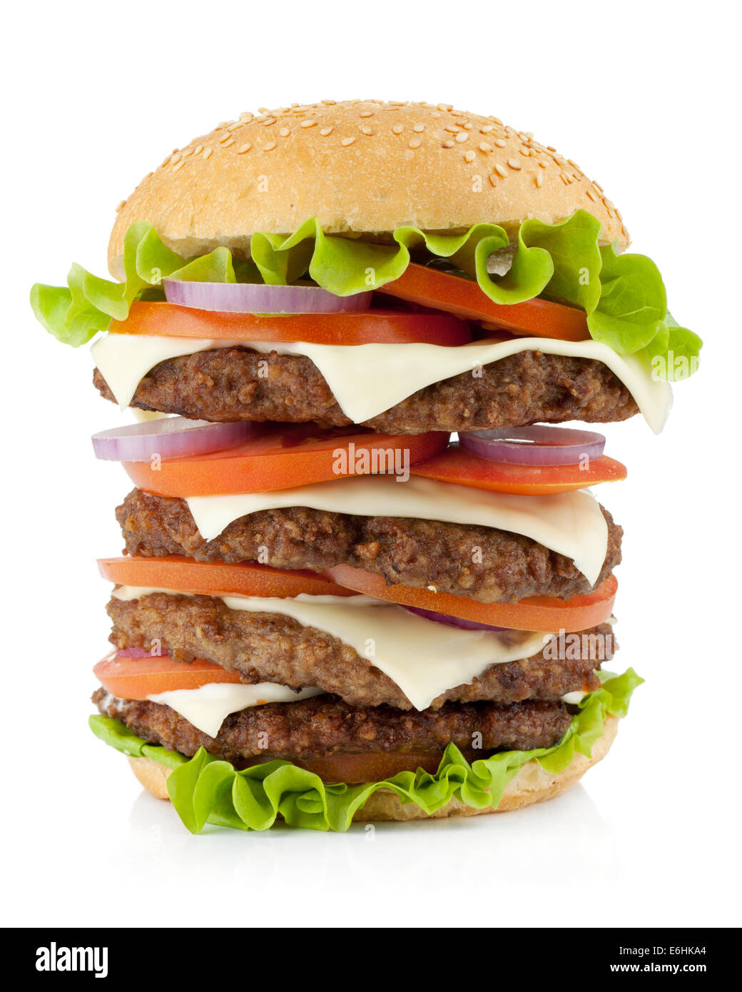 Huge burger with beef, cheese, onion and tomatoes. Isolated on white ...