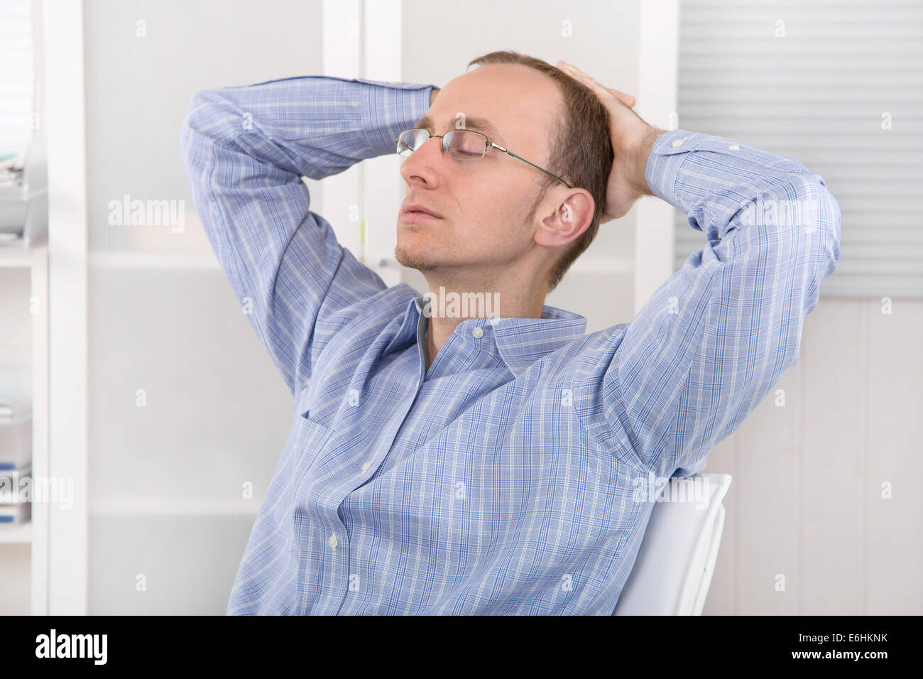 Businessman relaxing in the office at meantime. Work life balance ...