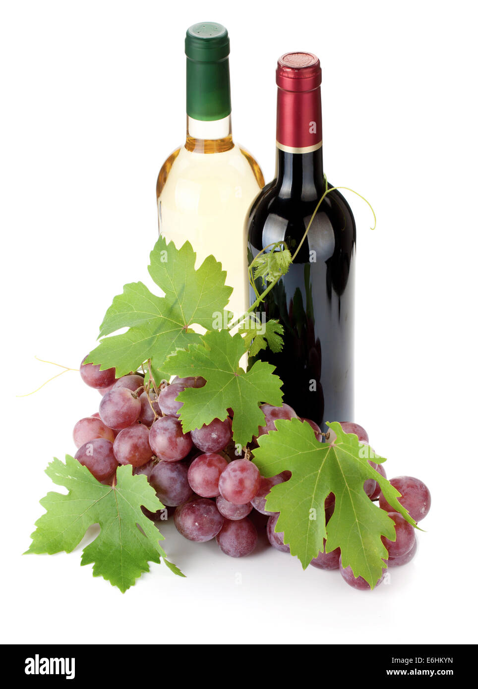 Two wine bottles and grapes. Isolated on white background Stock Photo ...