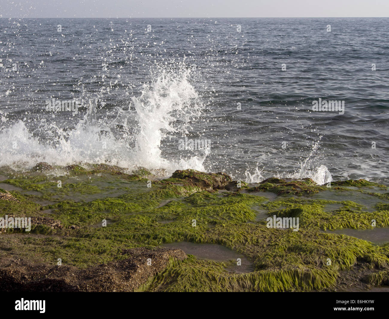Waves hitting cliff on beach hi-res stock photography and images - Alamy