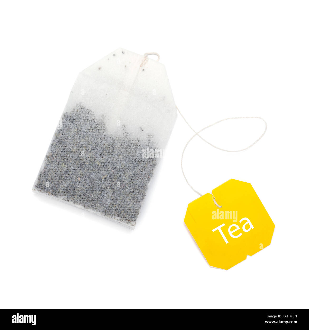 Teabag with yellow label. Isolated on white background Stock Photo - Alamy