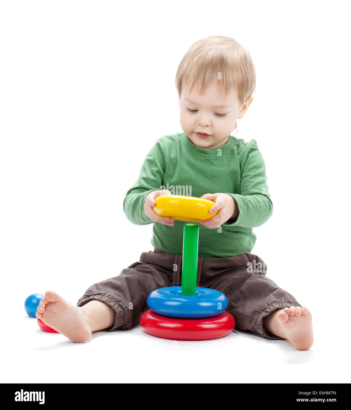 Small baby with a toy pyramid. Isolated on white background Stock Photo ...