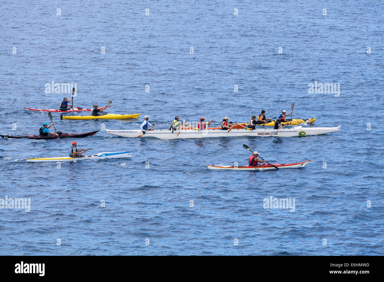 Canoeists setting off on a sea kayak race from Playa San Juan, tenerife ...