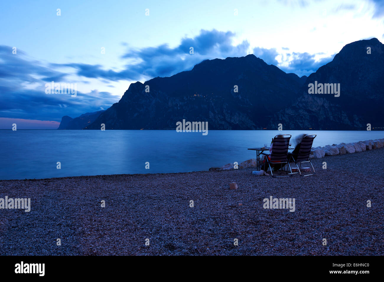 Lago di Garda pebble beach at dusk, Torbole, Lake Garda, Italian Lakes ...