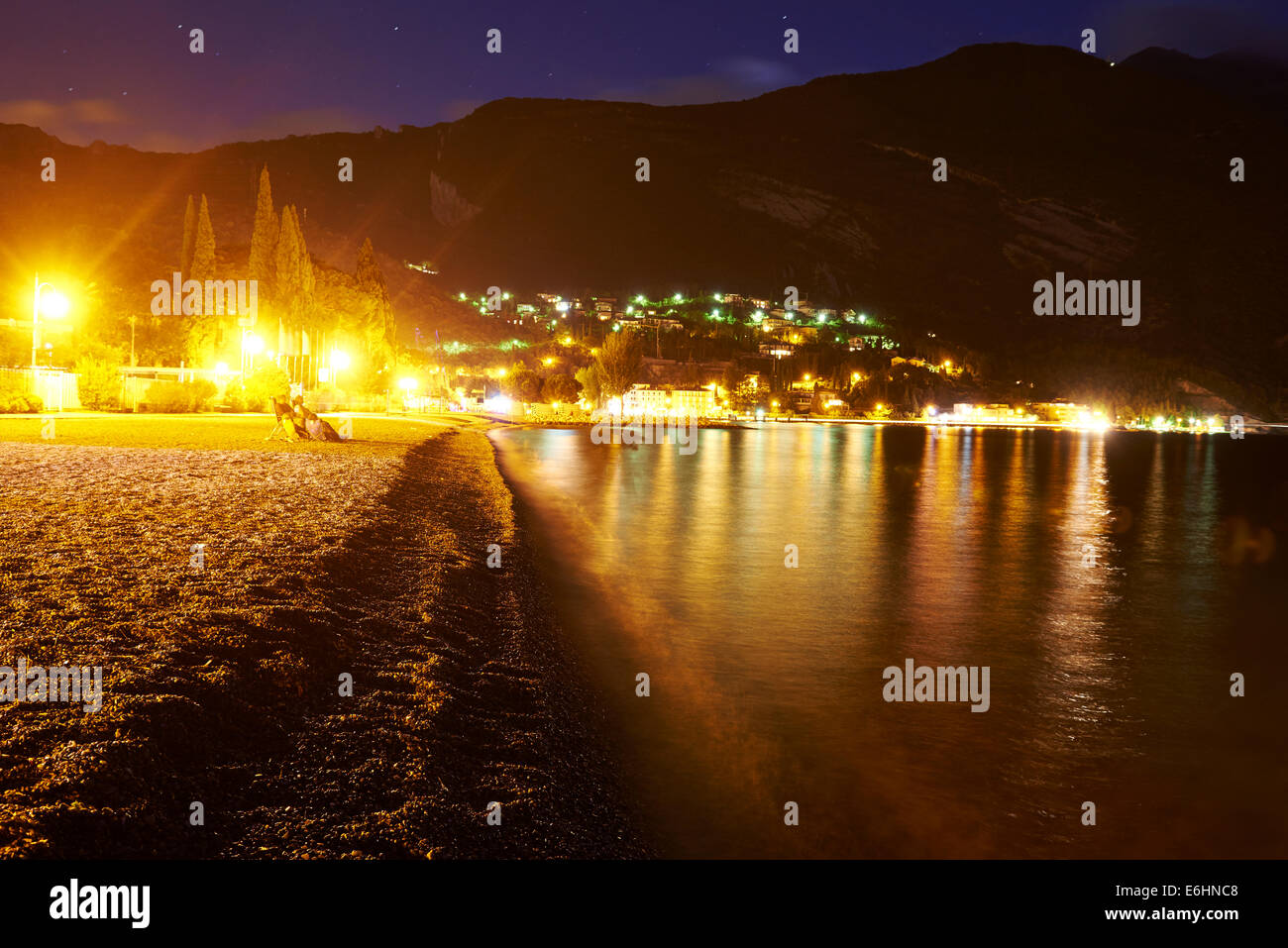 Lago di Garda pebble beach at dusk, Torbole, Lake Garda, Italian Lakes ...