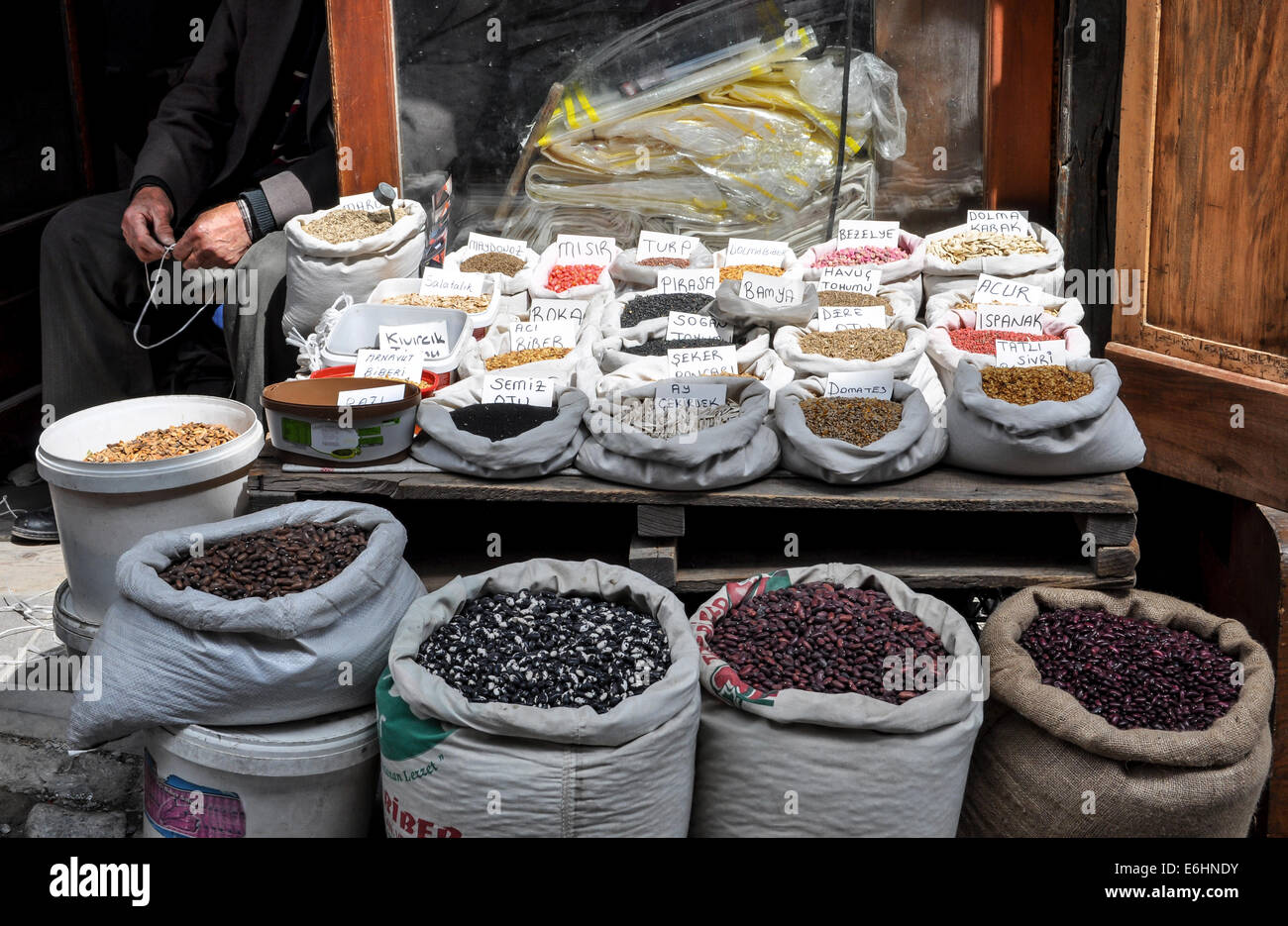 Spice market stall with heaped sacks and vendor in background Stock ...