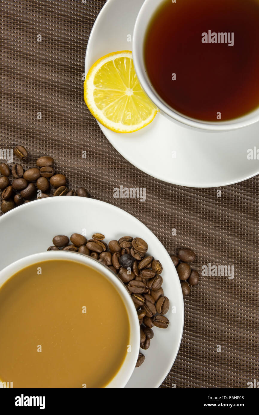 Cup of coffee and tea on brown background Stock Photo - Alamy