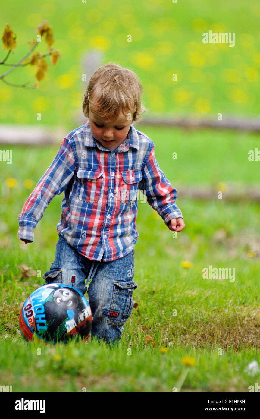 Boy kicking football hi-res stock photography and images - Alamy