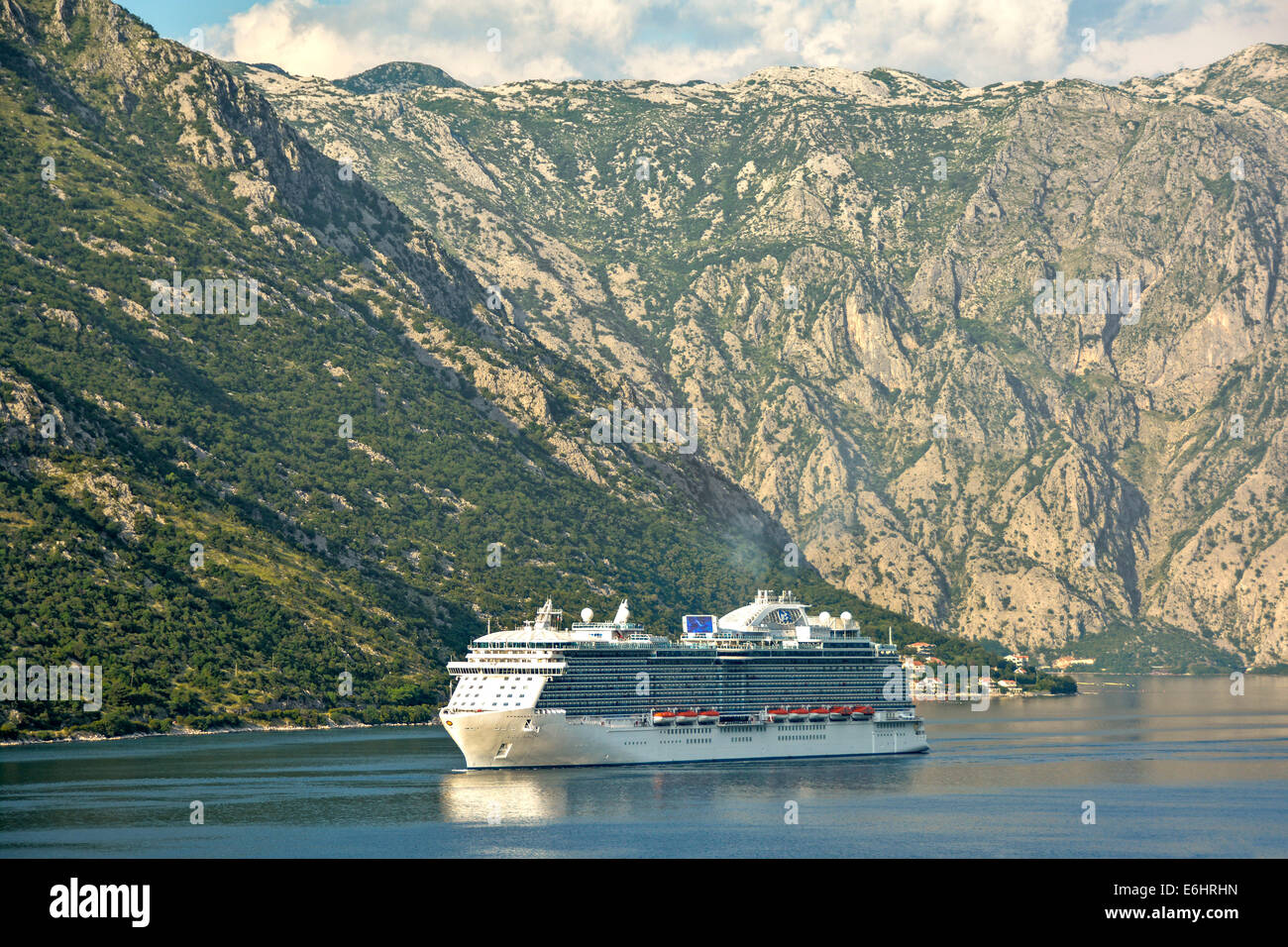 Cruise ship Regal Princess sailing in the fiord like scenery of Kotor ...