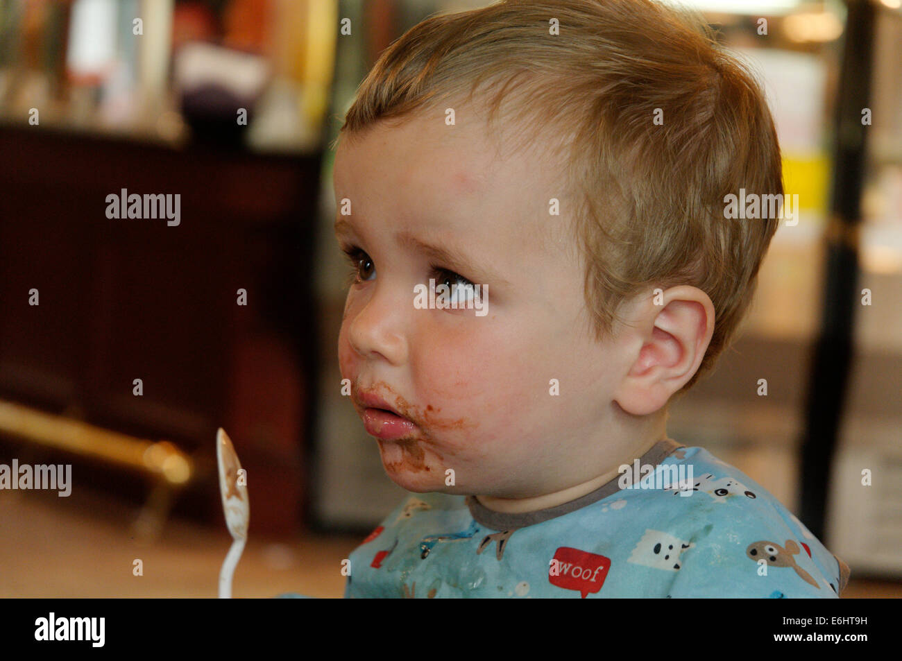 A two year old with chocolate sauce all over his face Stock Photo - Alamy