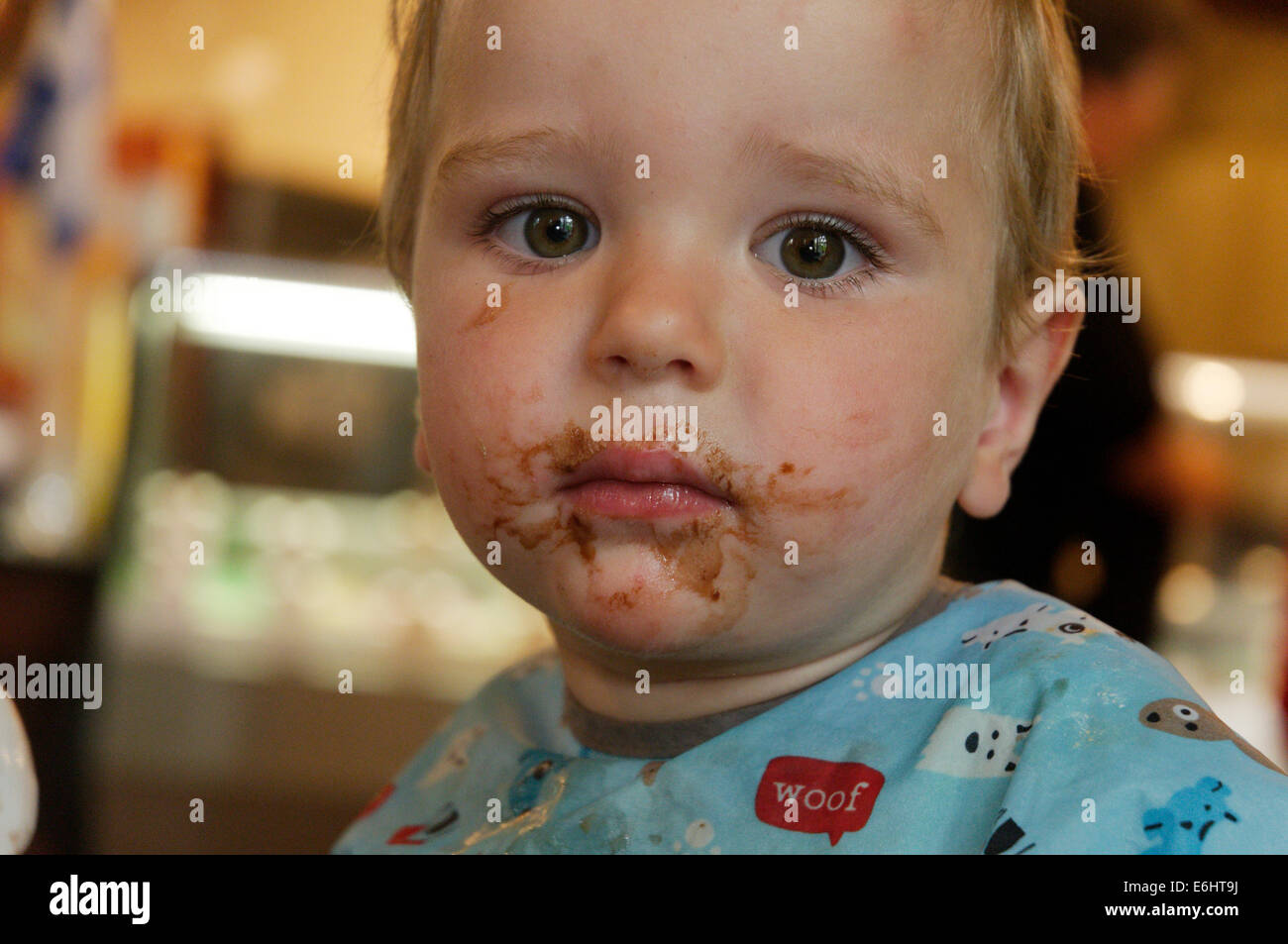 A two year old with chocolate sauce all over his face Stock Photo - Alamy