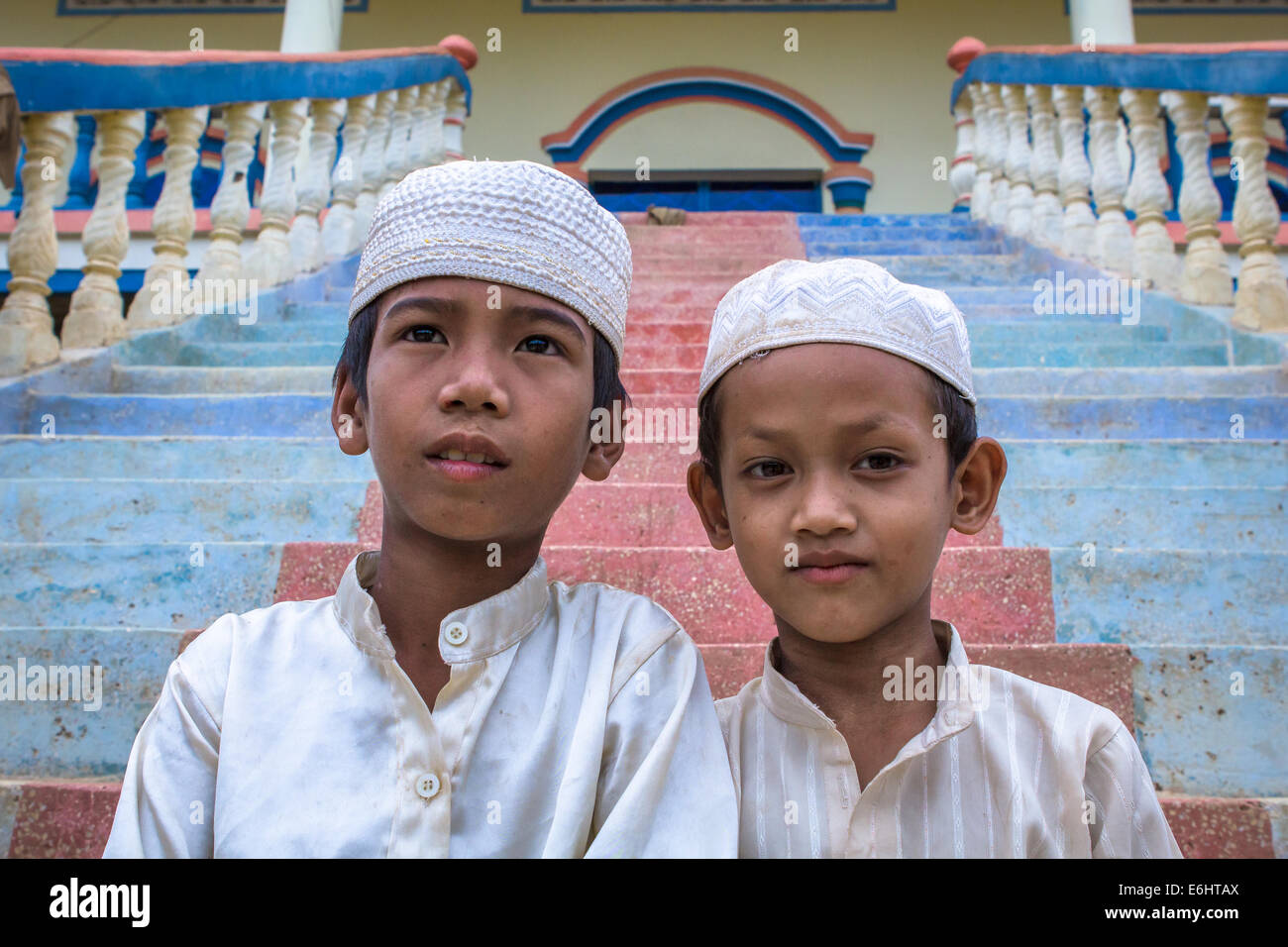 Two young Cambodian Cham Muslim boys, wearing their best clothes ...