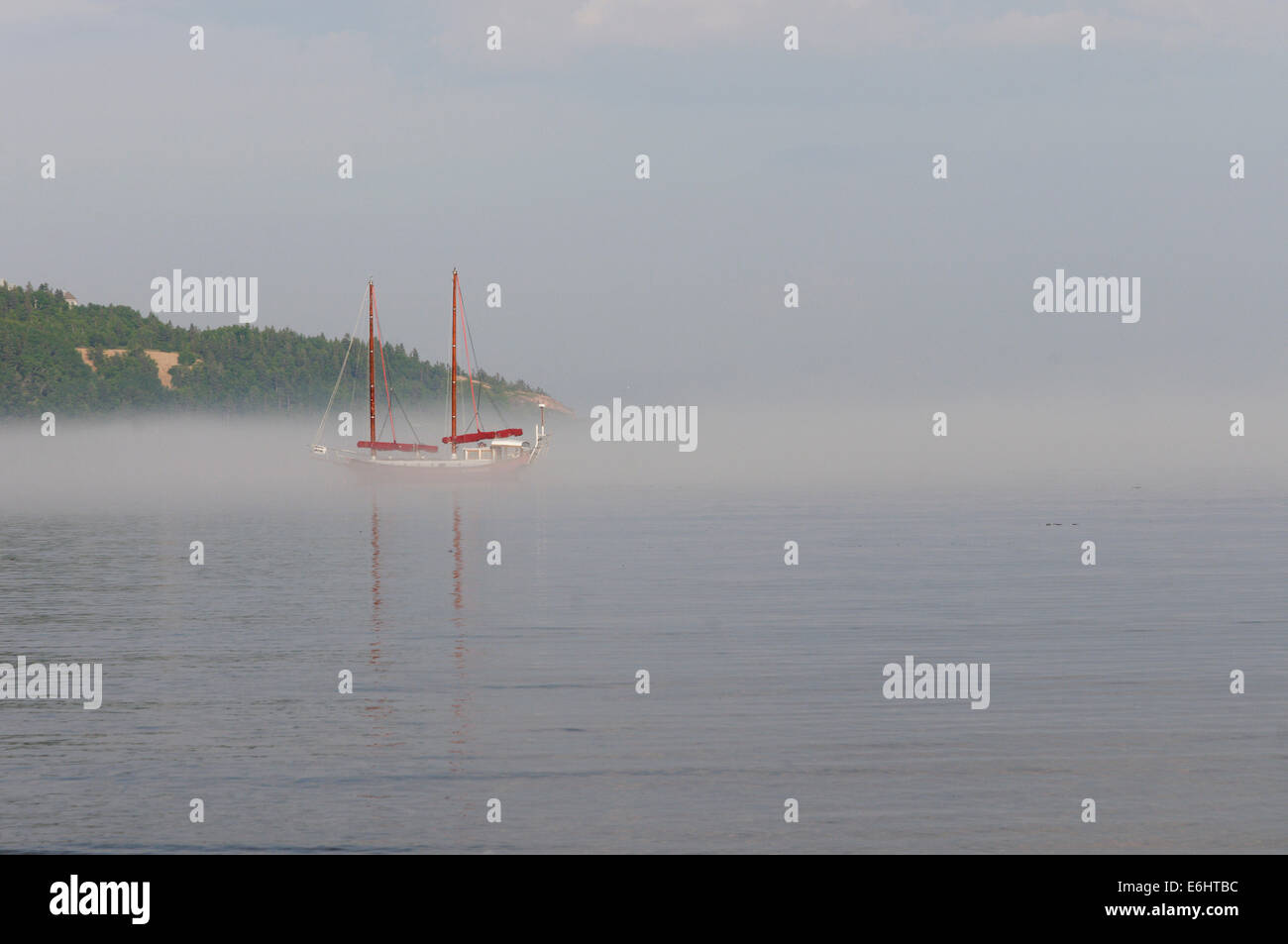 A two masted sailing boat in mist Stock Photo - Alamy