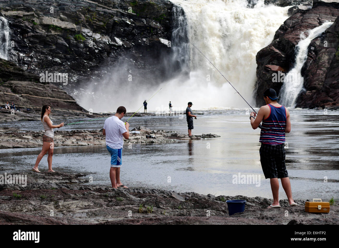 People fishing at Chute de la Chaudiere waterfall near Quebec City ...