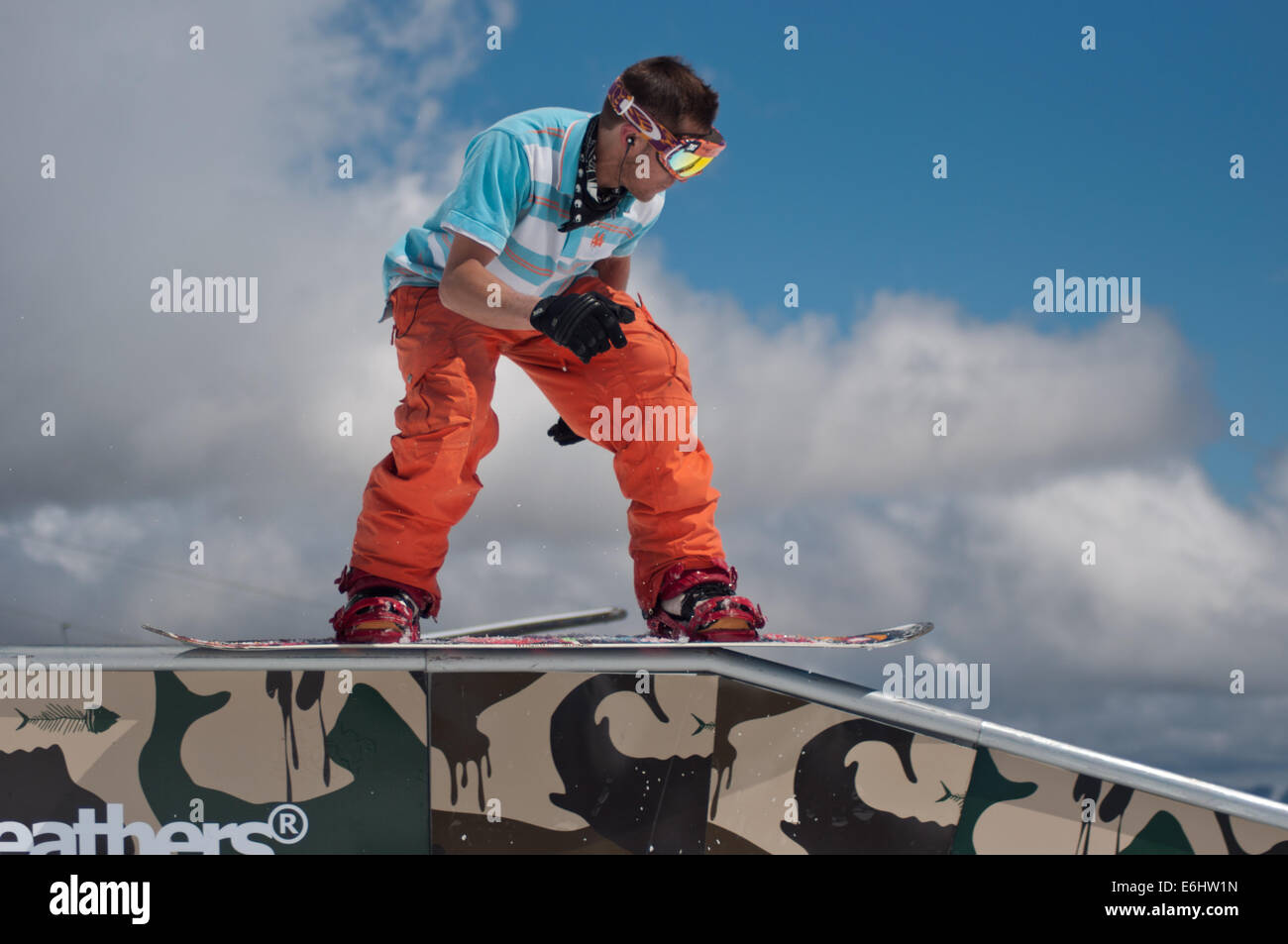 Snow and ski riders jump in the snow Stock Photo - Alamy