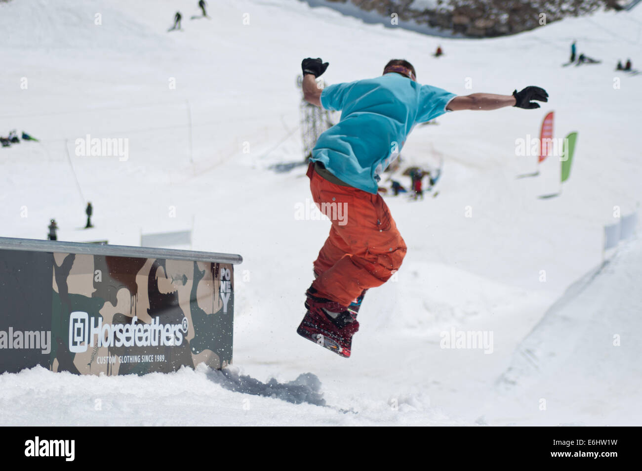 Snow and ski riders jump in the snow Stock Photo - Alamy