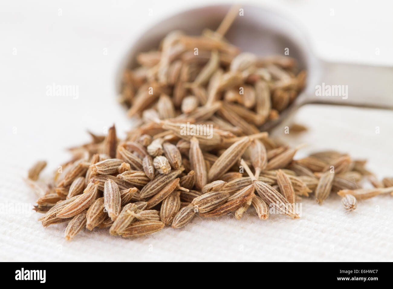 cumin seeds and spoon Stock Photo - Alamy