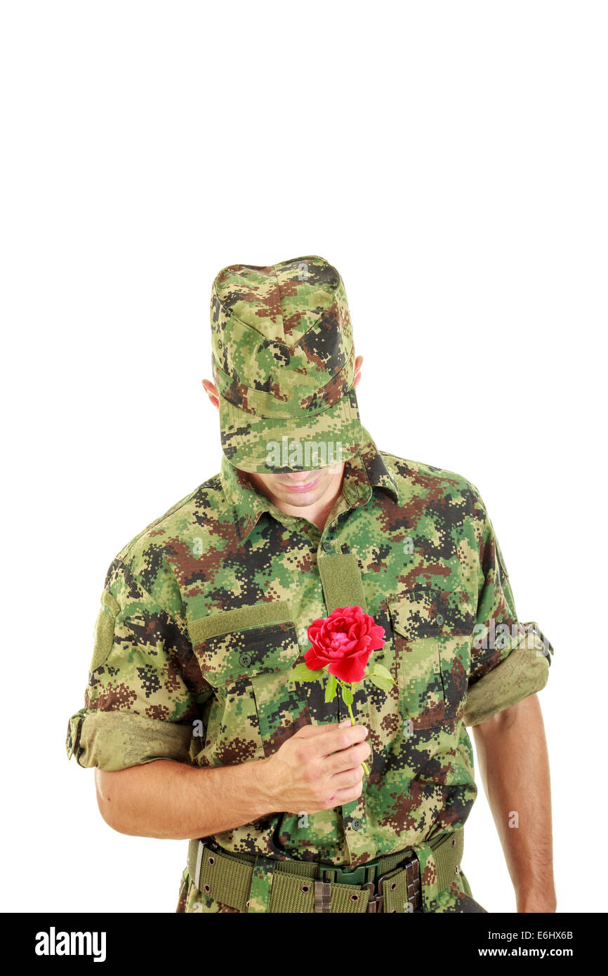 Make love not war, Romantic soldier holding rose Stock Photo - Alamy