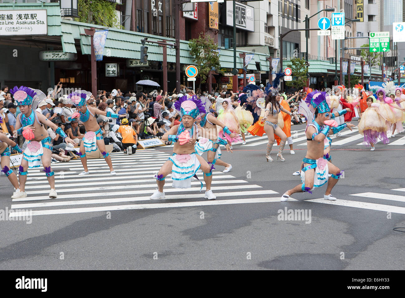 Tokyo, Japan. 23rd Aug, 2014. Samba dancers parade through the streets ...