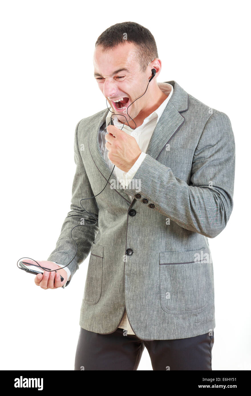 angry unhappy man in suit with headset and telephone mobile in his hand ...