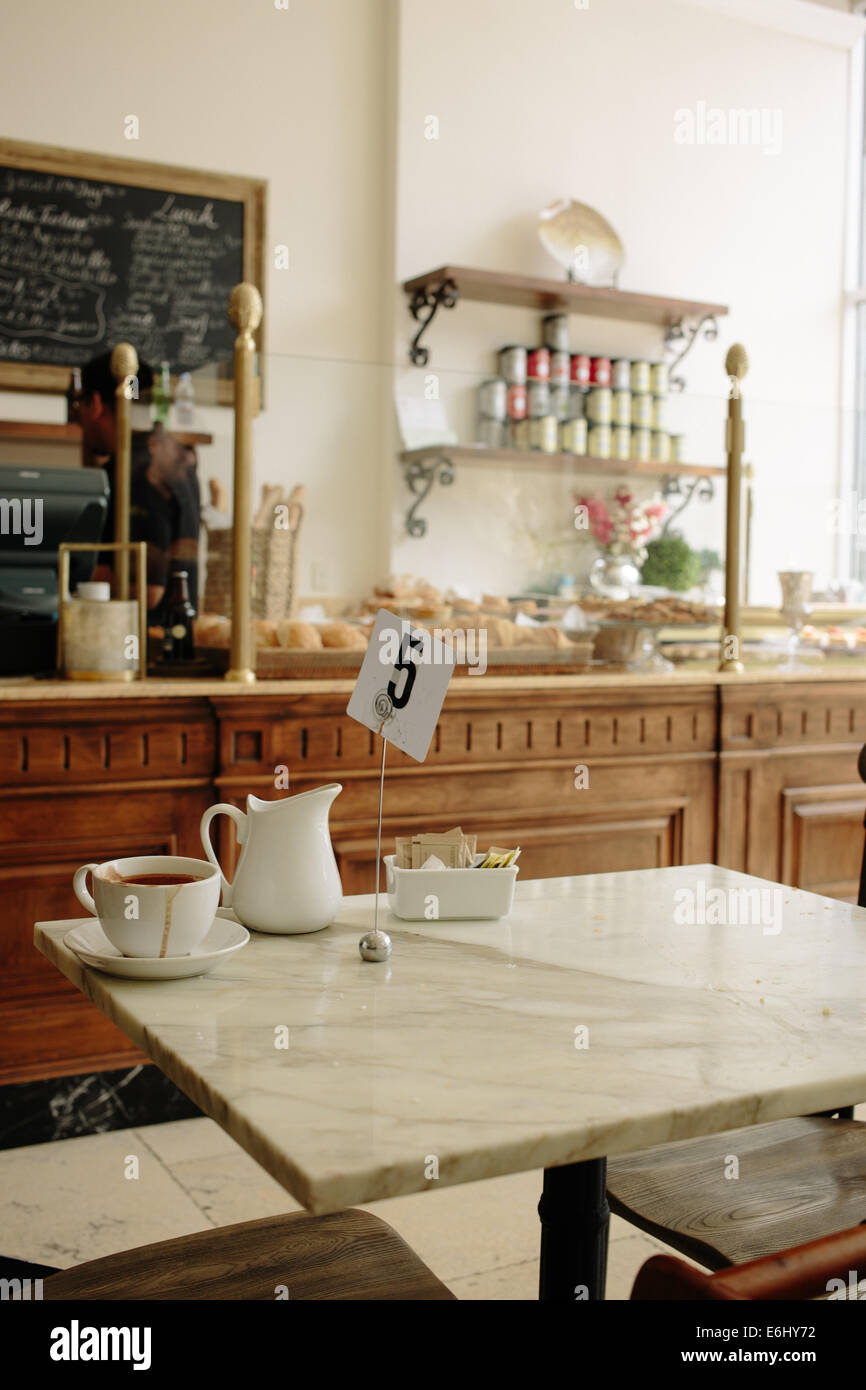 Marble table with coffee at French bakery and restaurant in Beverly ...