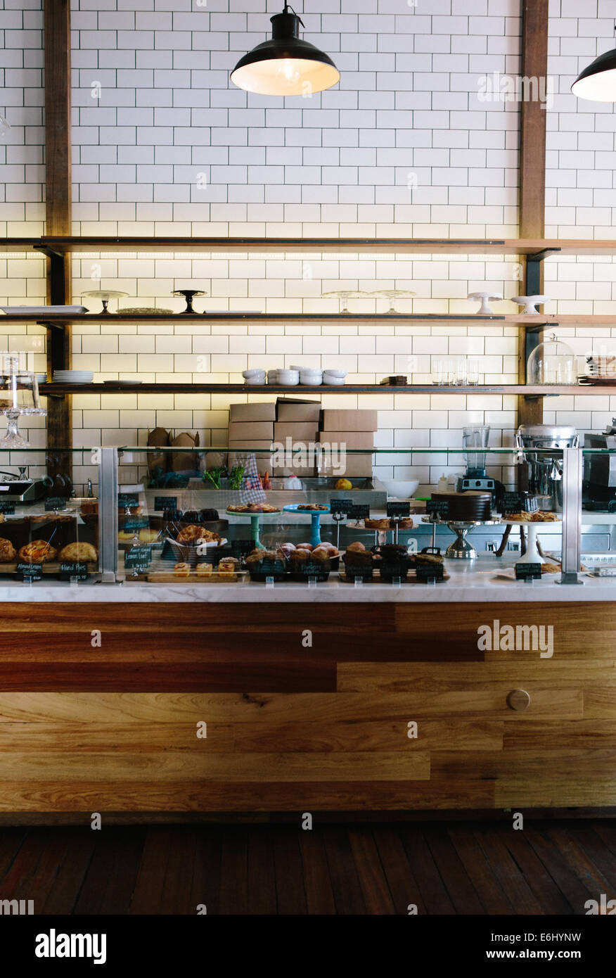 Wood counter with pastries and bread at modern, trendy cafe in Los ...