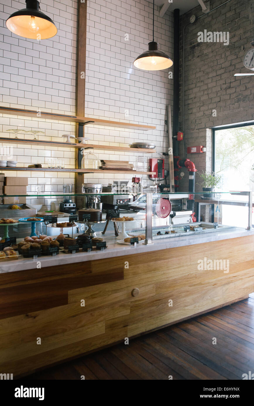Wood counter with pastries and bread at modern, trendy cafe in Los ...