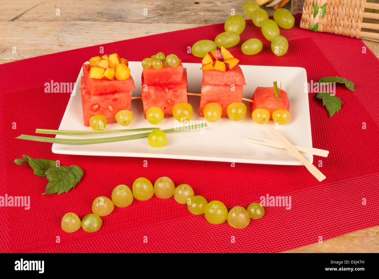 Fruity watermelon train, a creative dessert for kids Stock Photo - Alamy