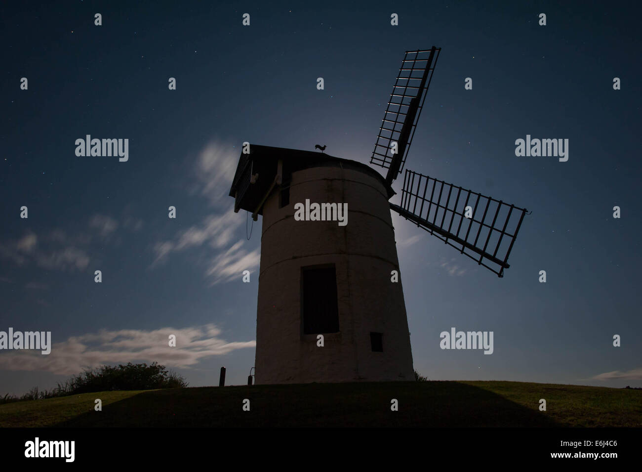 A windmill under the night sky Stock Photo - Alamy