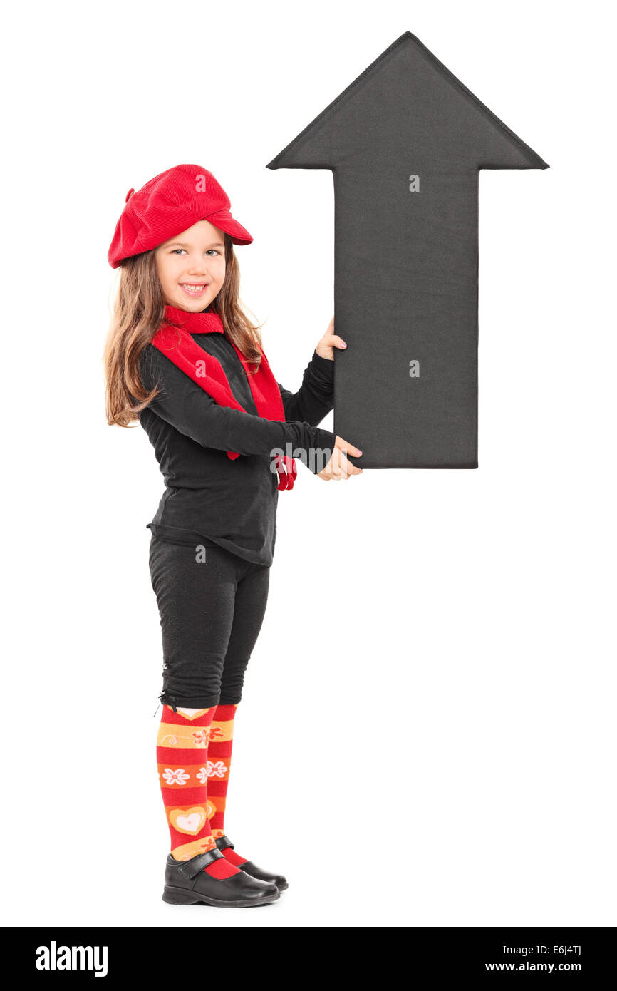 Full length portrait of a fashionable little girl holding a big arrow ...