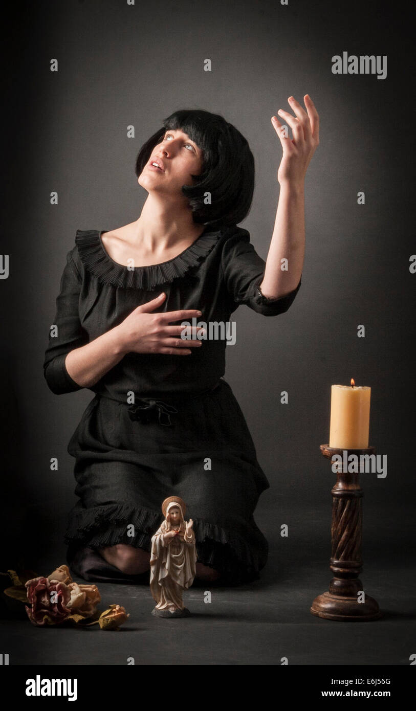 woman dressed in mourning beseeching God Stock Photo - Alamy